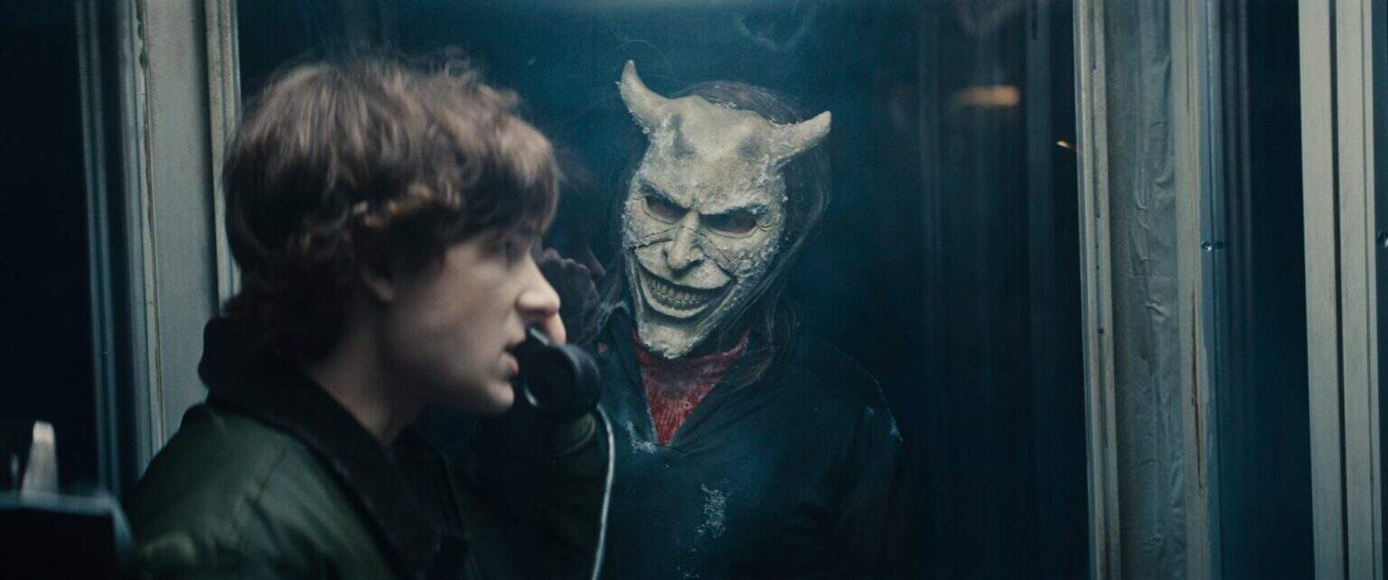 Ethan Hawke as the Grabber and Mason Thames as Finney in Black Phone 2 ...