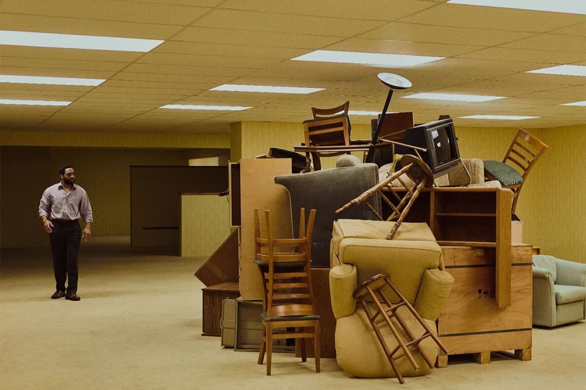 Clark stares at amassed chairs, armchairs and other pieces of furniture ...